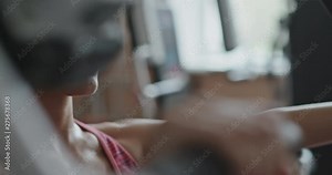 Attractive fit middle age woman athlete doing exercises on pectoral muscles in simulator. Gym Machine.