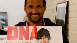 Tim Robards poses with his cover for DNA magazine from 13 years ago