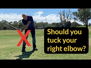 Right elbow tucked in golf swing