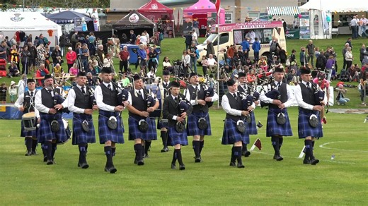 Kinross & District Pipeband, led by Pipe Major Stuart Scott, playing Rowan Tree as they arrived at the 2023 Crieff Highland Gathering. These were held on Sunday 20th August 2023 at Market Park in Crieff, Perthshire, Scotland. Kinross & District were awarded the Best Band award during these Games. There were six bands taking part in the Games, each having marched through Crieff to the Games and then around the arena before the Chieftain, Frank Duncan, a local resident and former Director of the C