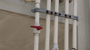 clip-1107109069-plumber-turning-water-shut-off-valve-pvc