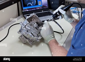 Video endoscopy. An employee checks a part of a gear case with the video endoscope Stock Photo - Alamy