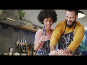 Couple Baking Together with Joy in Cozy Kitchen Video | WaveBreak Media