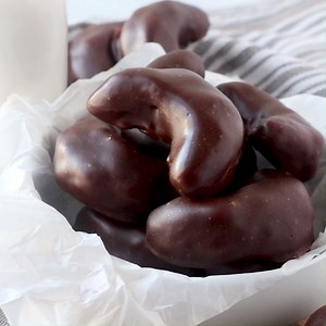 11K views · 15 reactions | Buttery cookies with bits of pecans are shaped into crescents and dipped in a chocolate coating for a perfect combination. These cookies have been favorites in our family for generations! Recipe: https://www.cookingwithcarlee.com/2015/12/fudge-dipped-crescent-cookies-holiday.html | Cooking With Carlee | Facebook