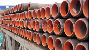 The top drive system of a drilling rig. The oil pipes are in a row