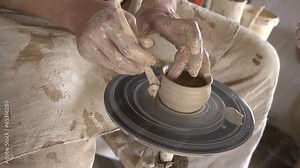 Potter and ceramic on turntable