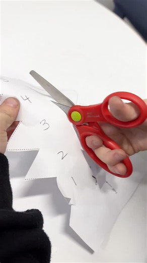SCISSOR SKILLS TIPS! ✂️Thumbs on top. ✂️ Write numbers for the helper hand to follow. (Sometimes we use stickers.) The helper hand is important for stabilising and manipulating the paper. It helps with accuracy and speed. It means that the child does not need to compensate by using the table and place their cutting hand/arm in an awkward position. Posture is more stable too as the child doesn’t need to twist or lean in the direction the paper is “flopping”. #scissorskills #handsonlearning #helpe