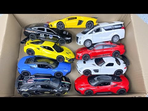 Box Full of Model Cars -Tesla Robotaxi, Tesla Cybertruck, Tesla Roadster, Lexus LC500, Lexus Lm 300h