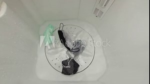Washing Fabric surgical mask with machine and laundry powder to disinfection coronavirus, covid 19 after leaving home to public area.