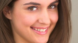 Happy woman smiling and laughing at camera