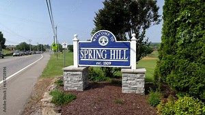 Welcome to Spring Hill, Tennessee sign with gimbal video walking forward.