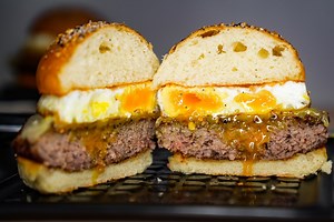 1.3M views · 27K reactions | Sunday Morning, Breakfast Calling . Half pound spicy sausage patty seasoned everything bagel. Fried eggs topped with white cheddar. All stacked on a homemade everything bagel topped bun. . . . : @thekitchenwhitelaw . . . #TheKitchenWhitelaw #breakfast #breakfastsandwich #brunch #egg #sausage #cheese #breakfastsando #sando #sandwich | The Kitchen Whitelaw | Facebook