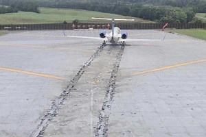 Plane stopped by concrete safety zone at end of Virginia airport runway