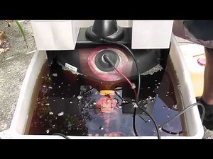 TV submerged under oil and then water