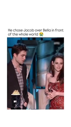 Meme humor on Instagram: "At the 2011 MTV Movie Awards, Robert Pattinson and Kristen Stewart won “Best Kiss" for The Twilight Saga: Eclipse, Viewers braced for the expected onstage peck, but Pattinson ditched the script and sprinted into the crowd-straight to Taylor Lautner, who played Jacob Black. He planted a dramatic kiss on him instead, turning the room into chaos and laughter. The gag winked at the era's loud “Team Edward vs. Team Jacob" obsession and delivered the funniest 'solution' possi
