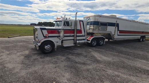 NOW LIVE: 1985 Peterbilt 359 Mini Semi -1985 Peterbilt 359 Mini Semi -Caterpillar 3208 636ci V8 Turbo-Diesel -Fuller Road Ranger 10-Speed Manual w/ Overdrive -RWD -White Exterior -Blue Interior -Hand Built by Tom Dell In Pittsfield, Illinois -All-Steel, ¾ Scale of Full-Size Semi -Sleeper Configuration Cab -Air Seats, Air Windows, Air Horn, Air Brakes -Dual Drive Rear End w/ Power Divider -Matching Feather-Lite Enclosed Car Trailer -A/C -Propane -Outdoor Awning -Closet -Bathroom -Sink -Best in Sh
