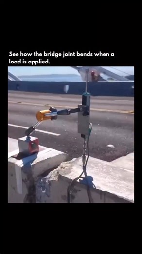Daily Facts & Reels. on Instagram: "If it doesn’t bend, it breaks. You are watching a Dynamic Load Test in action. While concrete feels solid to us, bridges are designed to be elastic. This sensor (likely an LVDT) is measuring the “Relative Slab Movement” as a heavy bus passes over the joint. Engineers track this displacement to ensure the joints are working correctly. If the bridge were perfectly rigid, the stress would cause it to snap. Flexibility = Safety."