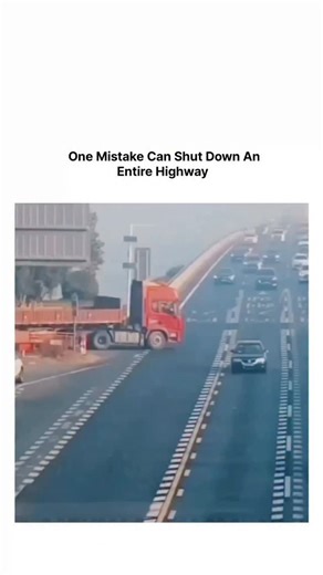 Explaining a car on Instagram: "The post features a 30-second highway chaos clip showing a bright red semi-truck trying to merge into fast-moving traffic directly from a construction-closed exit ramp-a maneuver that looks as risky as it sounds. Thick fog reduces visibility, cars are packed tightly on the highway, and the truck edges forward with painfully slow caution while impatient drivers whip around it, squeezing through gaps and creating several near-miss moments. The mix of poor conditions