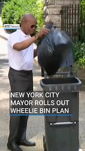 Thirty-five years after they were introduced in Ireland, New York City mayor Eric Adams has unveiled the city's first official NYC bin for trash pickup, along with a timeline aimed at getting residential units to put their rubbish into containers. | More: https://rte.ie/b/1458924 | RTÉ News