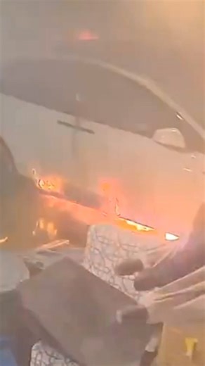WATCH: Video shows a Tesla burst into flames inside a Florida garage in the aftermath of Hurricane Helene. Officials say the car's battery may have ignited after coming into contact with Helene floodwater. | USA TODAY