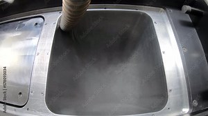 Pouring metal powder into working surface of 3D printer for metal. Selective laser melting technology. SLM. Flowing Metal Powder inside 3d printer for metal. Filling working chamber with powder.