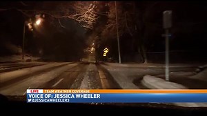 Checking road conditions after spring snow falls overnight