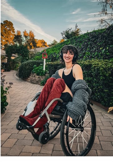 👀 Alt text: a woman in a Wheelcahir rolls into frame and stops in a wheelie, turns to face the other way and tucks her hair behind her ear. She backs out of frame still in the wheelie and says “eee hee”. #Funny #Random #Wheelie