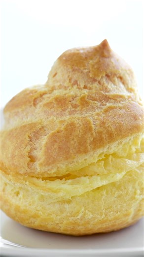 Our light, airy Cream Puff recipe is made with a basic 4-ingredient choux pastry dough. Fill the cream puffs with whipped cream or pudding! #creampuff #pastry #thegunnysack #eastertreat #whippedcream #homemade #creampuffs | The Gunny Sack