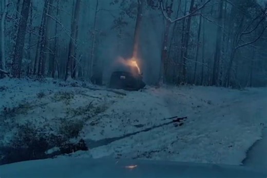 Driver trapped in burning Tesla saved in dramatic rescue