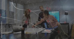 Woman in pink pointing layout issue while team comparing design schematics with animated 3D model