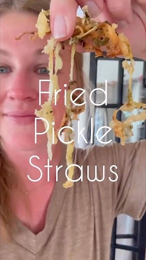 FRIED PICKLE STRAWS?! I used the spiral zoodle cutter from my chopper, made pickle noodles and then fried them up to top on our burgers and I’ll never go back. It’s a twist on onion straws but with pickles and perfect for all the cookouts! . 2-3 whole dill pickles 1 cup buttermilk (optional) 1 cup flour 1 tsp pepper 1/2 tsp garlic powder Cooking oil (I used avocado oil) . Take your whole pickle and spin it through the spiral cutter. You want long strands of pickles. Take the strands and soak in