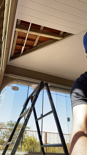 Construction Project: Installing Ceiling Panels Outdoors