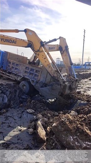 Truck stuck in mud - excavator rescue process