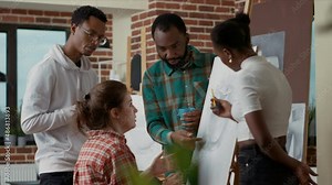 Diverse group of students brainstorming ideas to create vase drawing in art class program, attending workshop to develop artistic practice skills on canvas. Artwork inspiration to draw on paper.