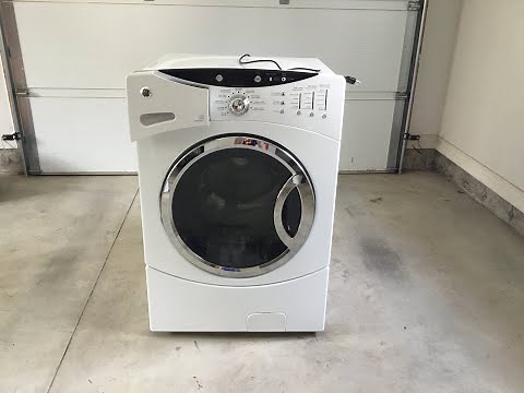 Scrapping a washing machine for copper, silver, aluminum, and other metals.
