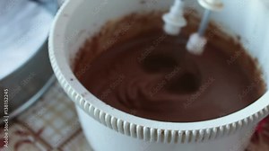 Baking a cake - mixing ingredients with an electric hand mixer