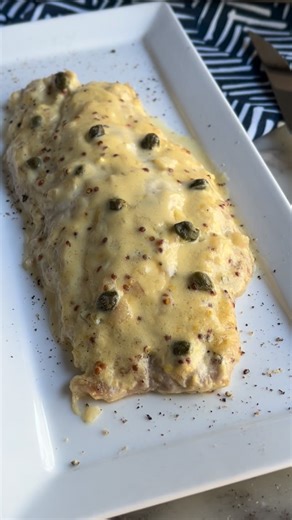 Ina Garten’s Mustard-Roasted Fish was recipe number 10 of the project, and it’s still one of those dishes I think about when I picture those early “side-by-side” posts. I kinda miss those short but sweet captions like: “My glob looks nothing like Ina’s Mustard-Roasted Fish… but this was HEAVEN in my mouth.” For such a simple dish, it delivers so much comfort. Fillets of red snapper get smothered in a thick, tangy Dijon–crème fraîche sauce with minced shallots and briny capers, then baked just 10