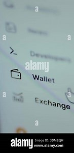 Interface for a digital wallet app with options to manage currency exchanges, hand icon tapping the wallet icon Stock Video Footage - Alamy