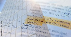 Highlighted dictionary text showing leader definition over building animation