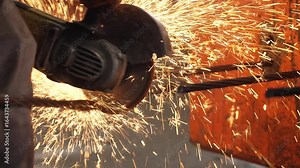 A worker using a sprayer to apply water inside a concrete mold, highlighting the importance of maintaining optimal conditions during the curing process in construction, fa01