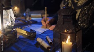 Historical background. Writing in ancient times. historical topics. Man writing by candlelight. Stock Video