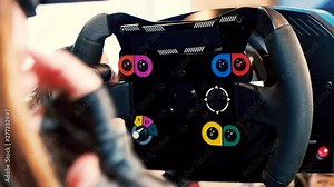 Happy woman playing with a driving simulator video game, she is wearing a virtual reality headset and using a racing wheel controller, technology and entertainment concept