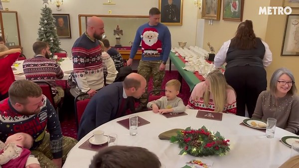Prince William chats with kids before handing out presents to military families