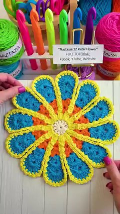 126K views · 2K reactions | To crochet this 12 point flower, you'll start with double crochet stitches made in the round, then move onto V stitches in the round. To finish, you'll use surface crochet to outline each petal. #reels #crochet #knittingaddict #yarn #wool #flowers #artist #tutorial #howto #visualart #naztazia | Naztazia | Facebook