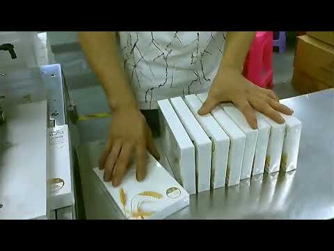 Automatic cellophane film overwrapping machine