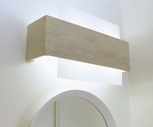 Camouflaging a Dated Off-center Bathroom Lighting Fixture
