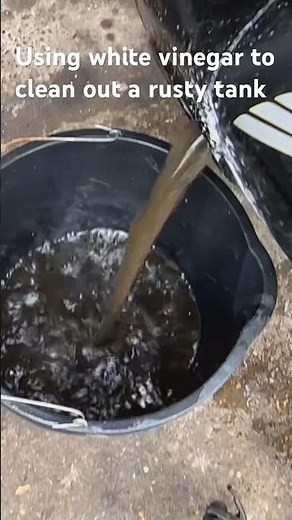 Cleaning out a rusty motorcycle gas tank with white vinegar