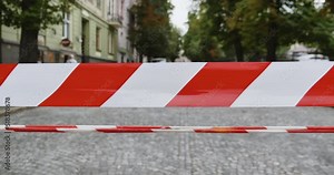Red and White Lines of barrier tape. Red White warning tape pole fencing is protects for No entry, closeup