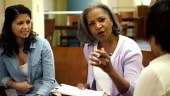Beautiful senior African American college professor meets with a...