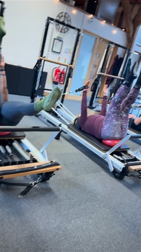 One arm, unstable base, nowhere to hide. Balancing on the ball under the pelvis while the strap loads one side forces true control - core, hips, and shoulder all talking to each other. Unilateral work isn’t about doing less, it is helping to create your more balanced body and it is not easy. These guys are nailing their balance here 🤍. #unilateralwork #reformertraining #corecontrol #movementintegrity | My Pilates House